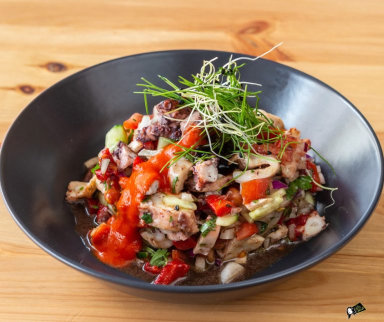 gourmet-looking-meal-of-cooked-octopus-mixed-with-a-vegan-salad-a ...