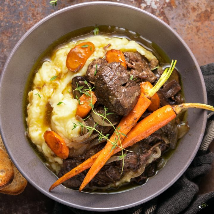 beef-bourguignon-served-in-a-rustic-manner-with-smashed-potatoes ...